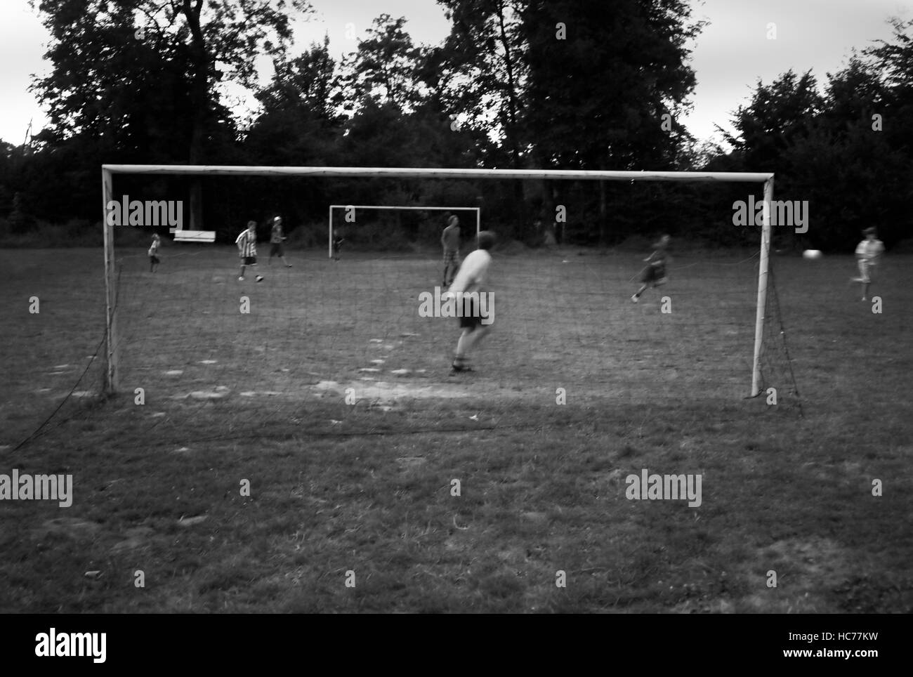 Kids playing football black and white hi-res stock photography and ...