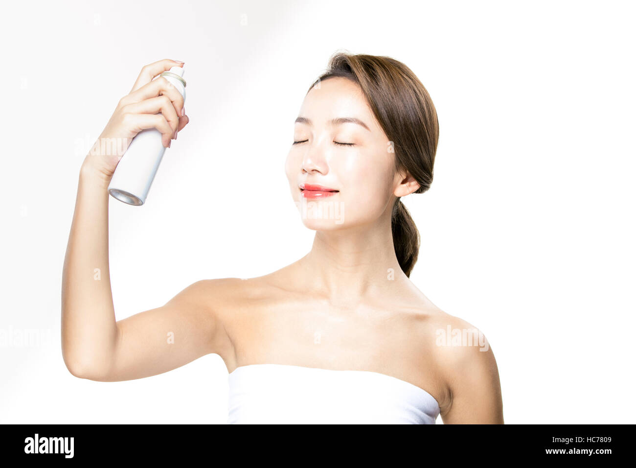 Woman spraying face hi-res stock photography and images - Alamy