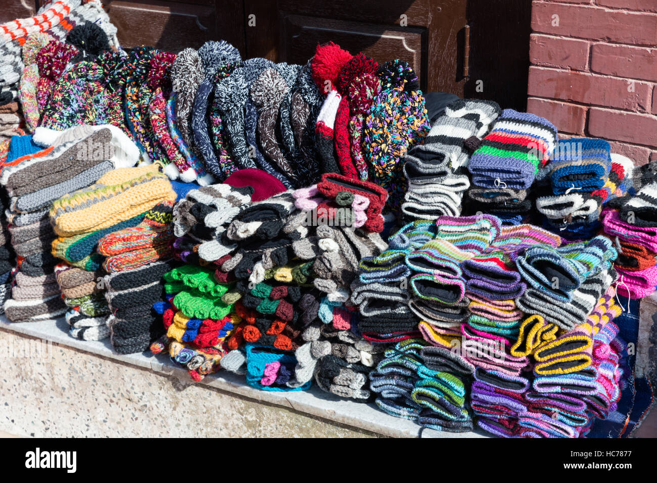 Nepalese handmade knitted hats and mittens Stock Photo - Alamy