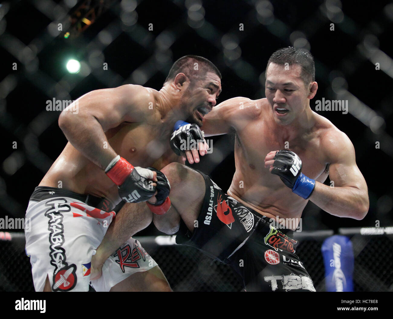 UFC fighter Mark Munoz, left, fights Yushin Okami at UFC-Live: Jones vs ...