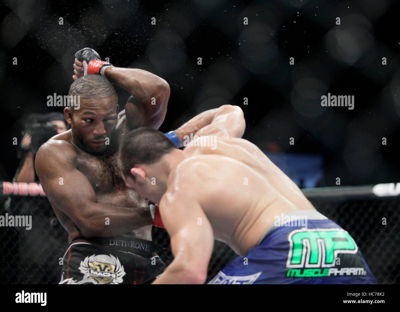 UFC fighter John Howard, left, fights Jake Ellenberger at UFC-Live ...