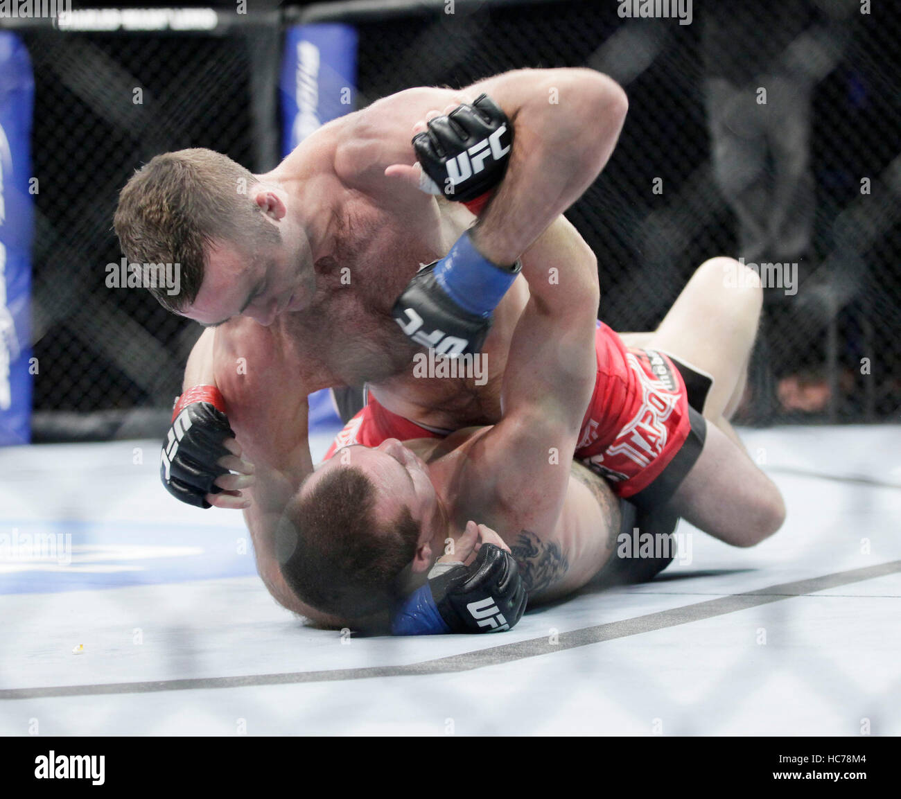 UFC fighter Paul Kelly, bottom, fights Jacob Volkmann at UFC-Live ...