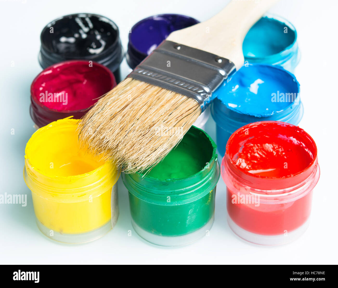 brush with a brightly colored paints Stock Photo - Alamy