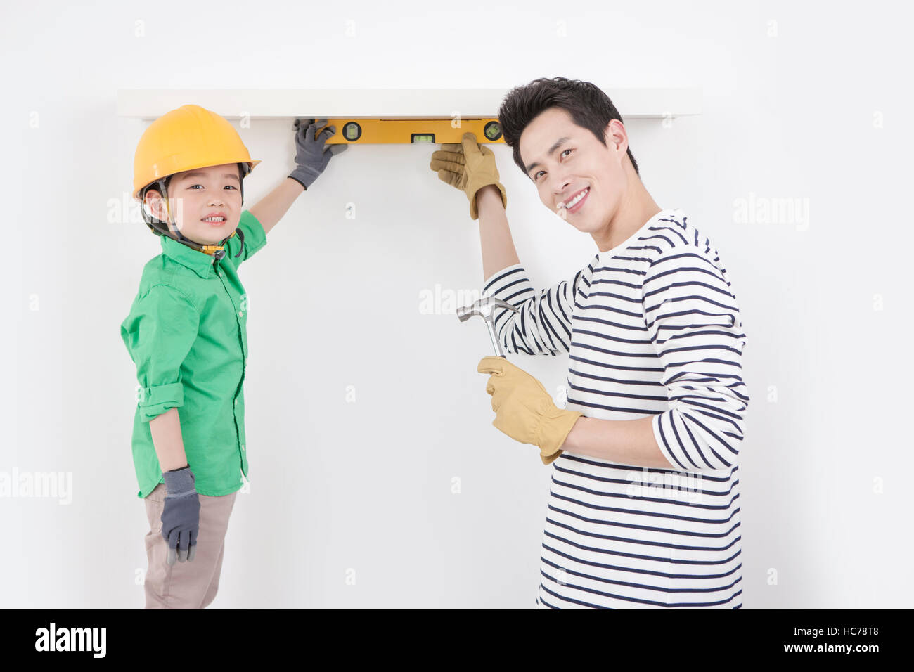 Father holding son working hi-res stock photography and images - Alamy