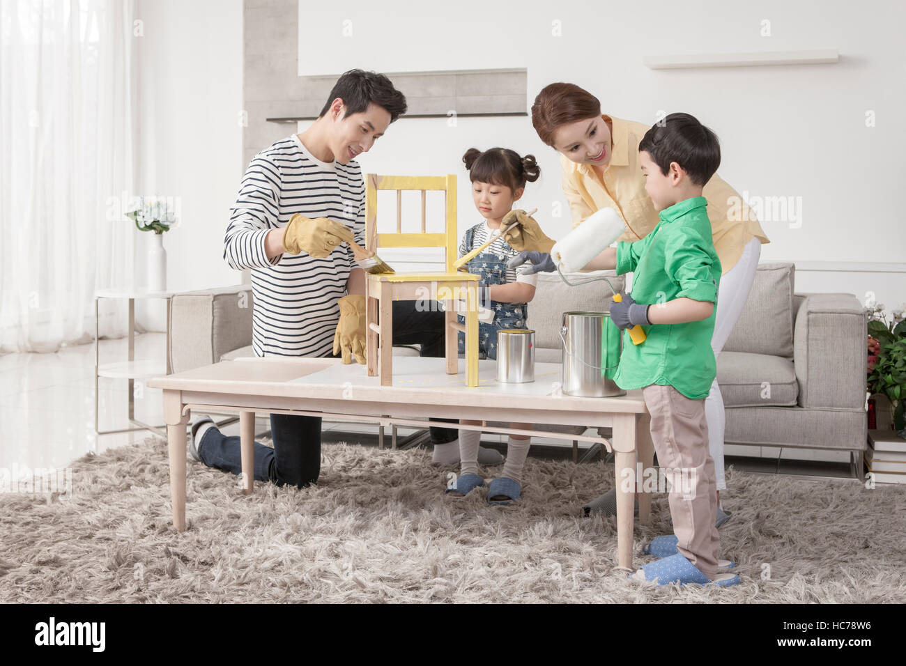 Harmonious family working together with tools Stock Photo - Alamy