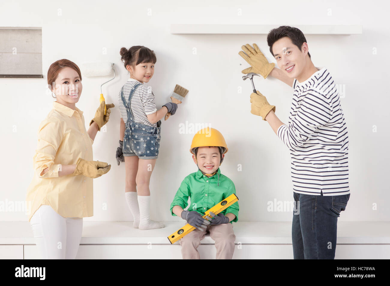 Harmonious family with tools Stock Photo - Alamy