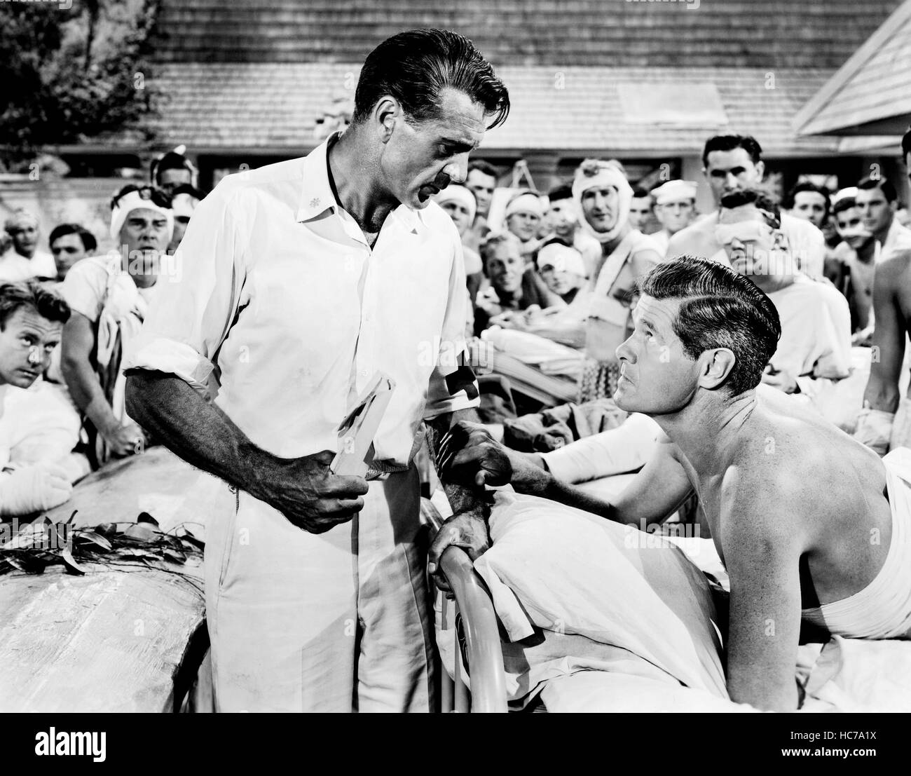 THE STORY OF DR. WASSELL, Dennis O'Keefe (extreme left), face to face ...