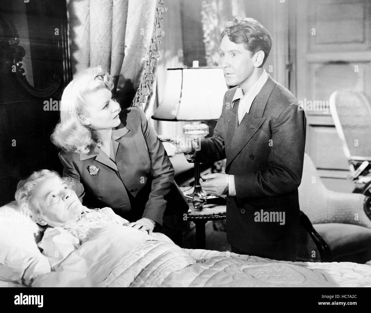 STREET OF CHANCE, from left: Adeline De Walt Reynolds (in bed), Claire Trevor, Burgess Meredith ...