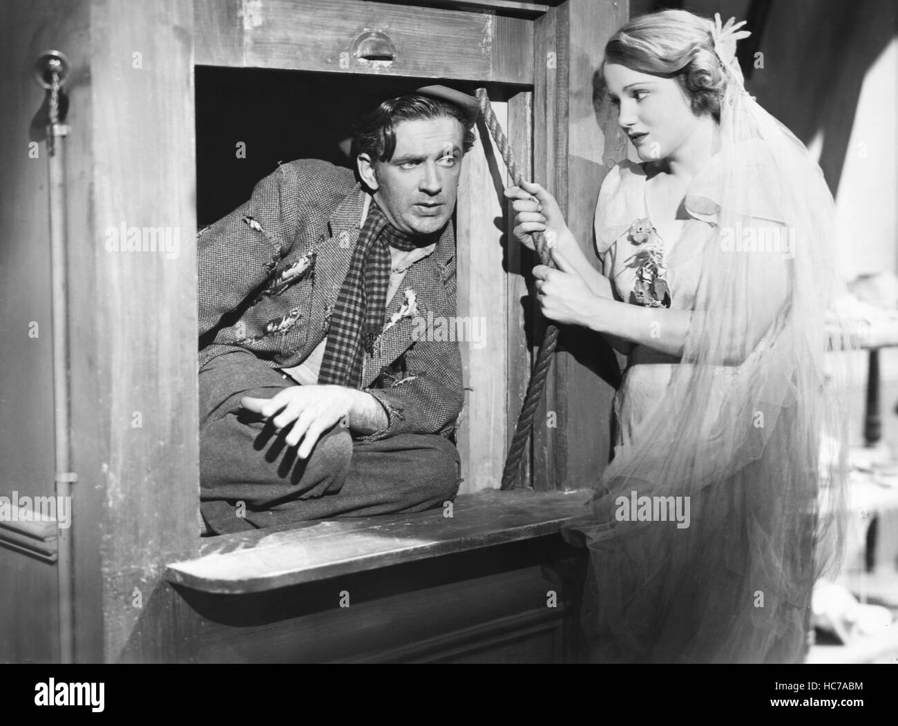 STRANGERS ON A HONEYMOON, from left: Hugh Sinclair, Constance Cummings ...