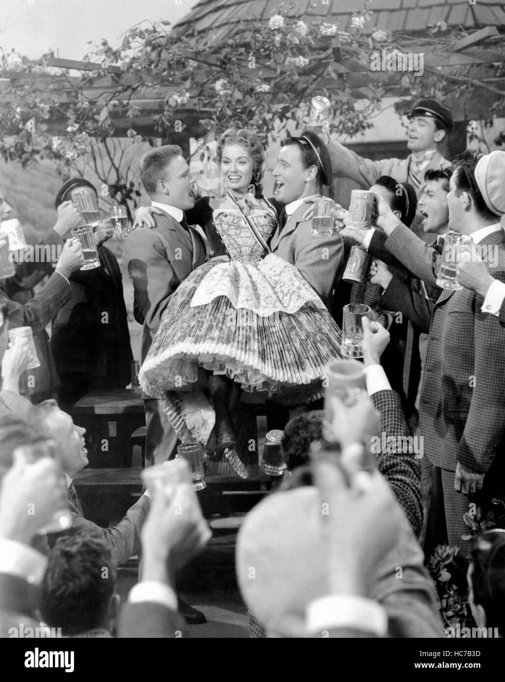 THE STUDENT PRINCE, Ann Blyth, being hoisted by (from left) John ...