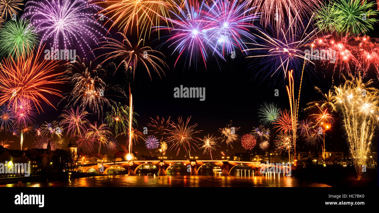 Cheerful fireworks display in the city, with lots of colorful bangs ...
