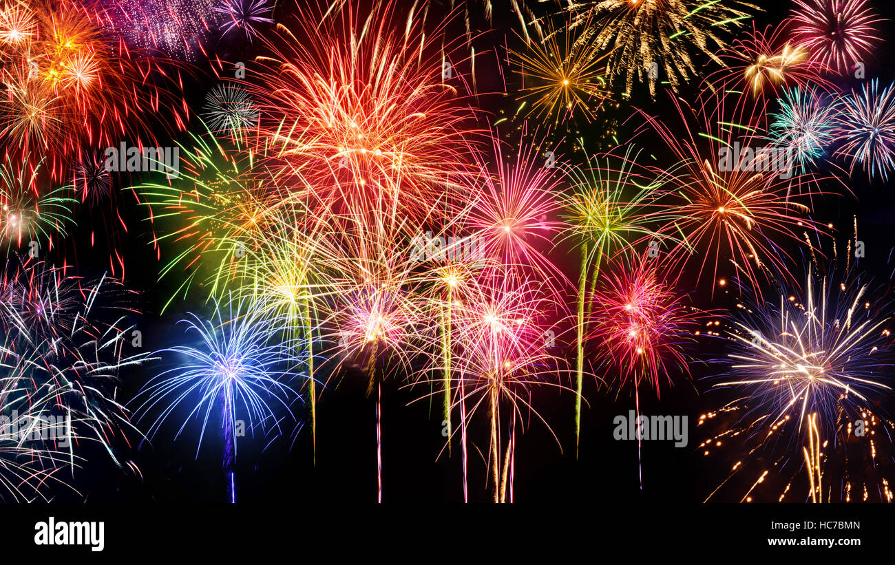 Lively multi-colored fireworks on black background, ideal for New Year ...