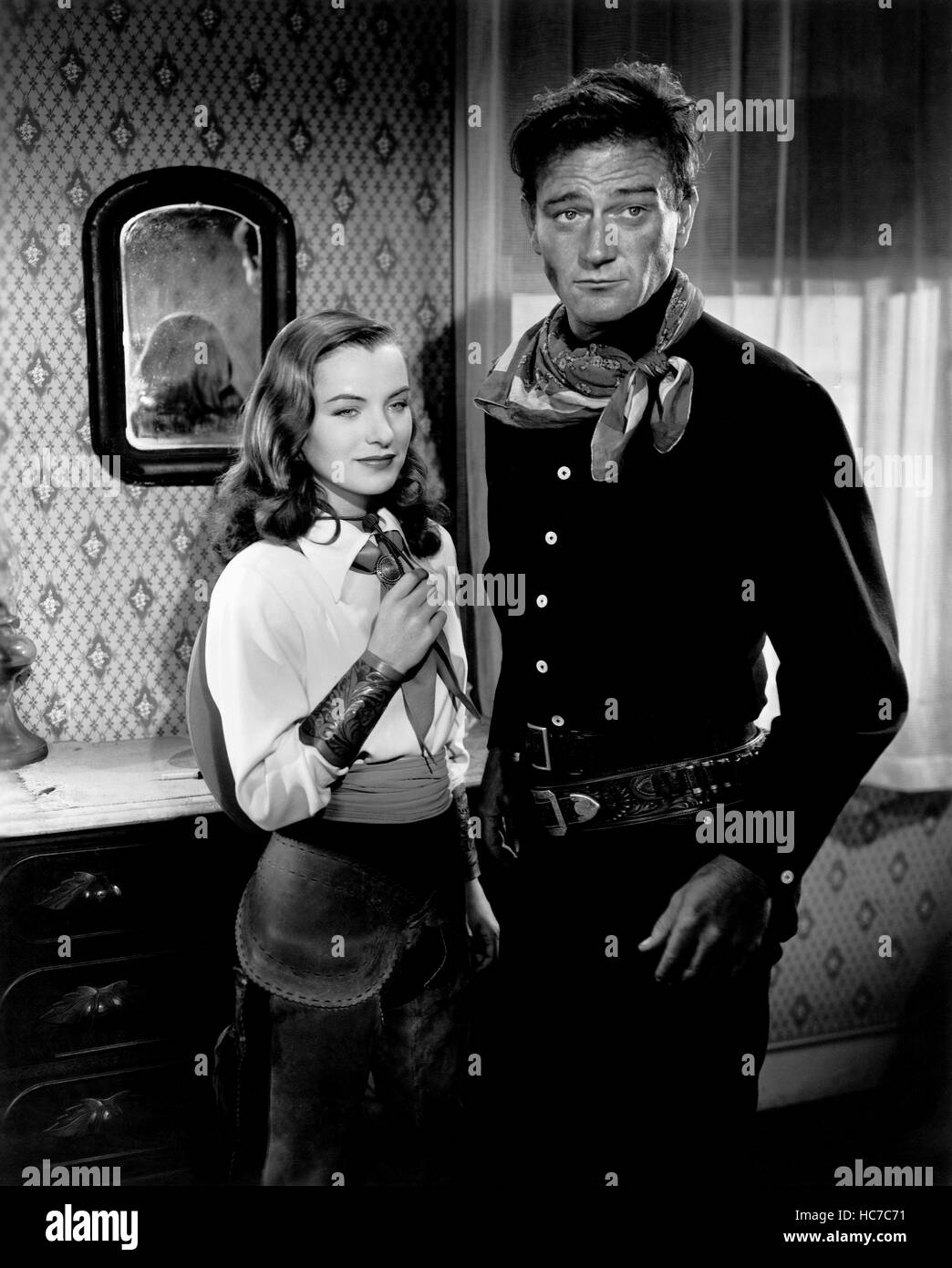 TALL IN THE SADDLE, from left, Ella Raines, John Wayne, 1944 Stock ...