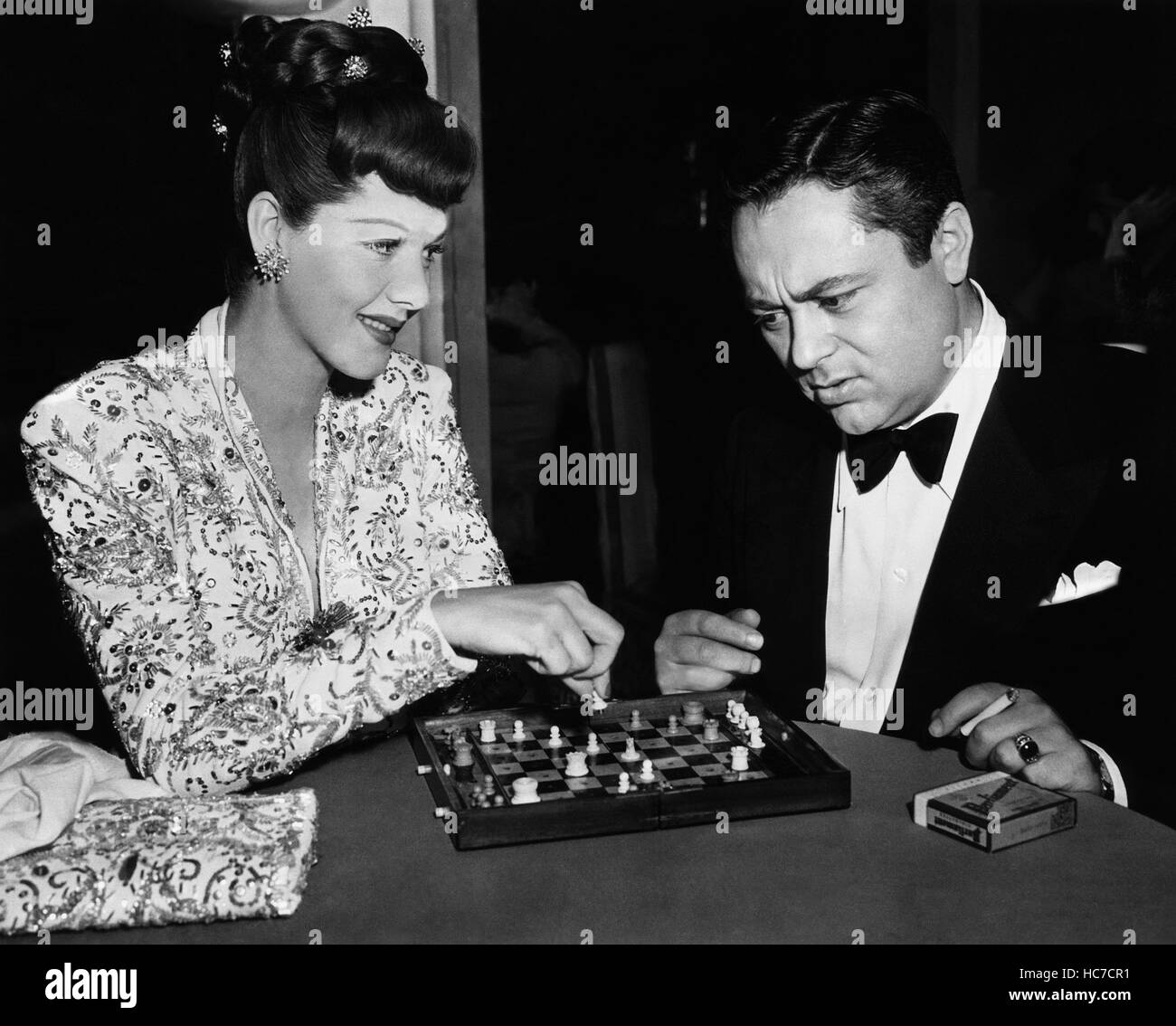 TANGIER, from left, Maria Montez, J. Edward Bromberg, playing chess ...