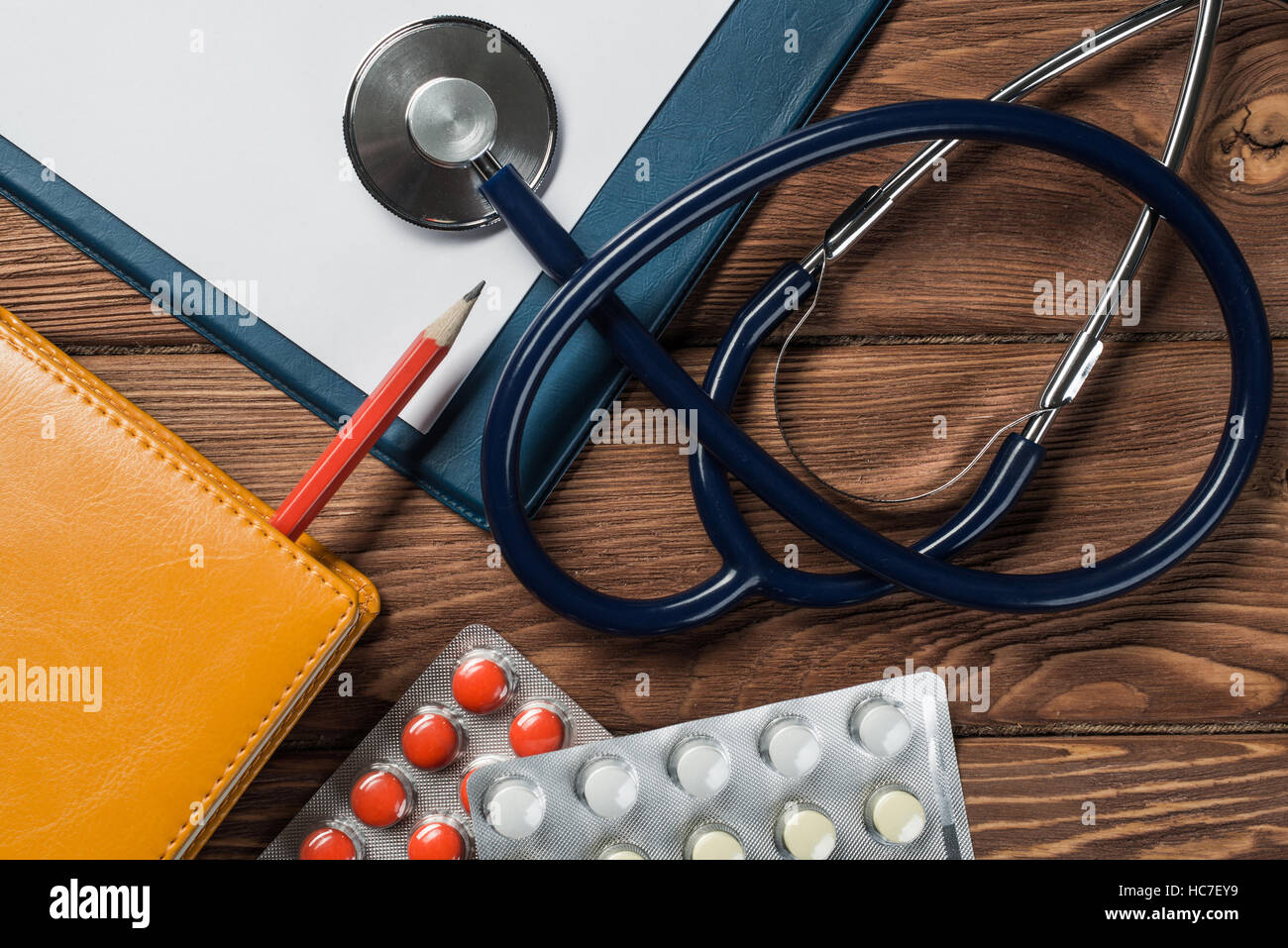 Desk of doctor with medicine things Stock Photo - Alamy
