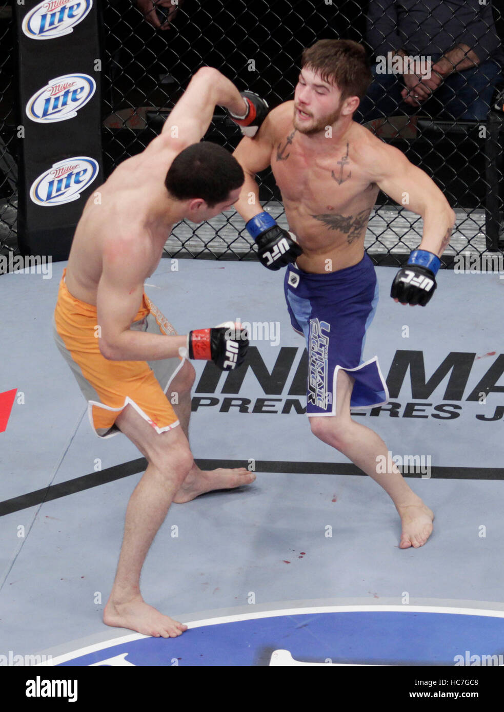 Roland Delorme, left, fights Josh Ferguson at The Ultimate Fighter 14 ...