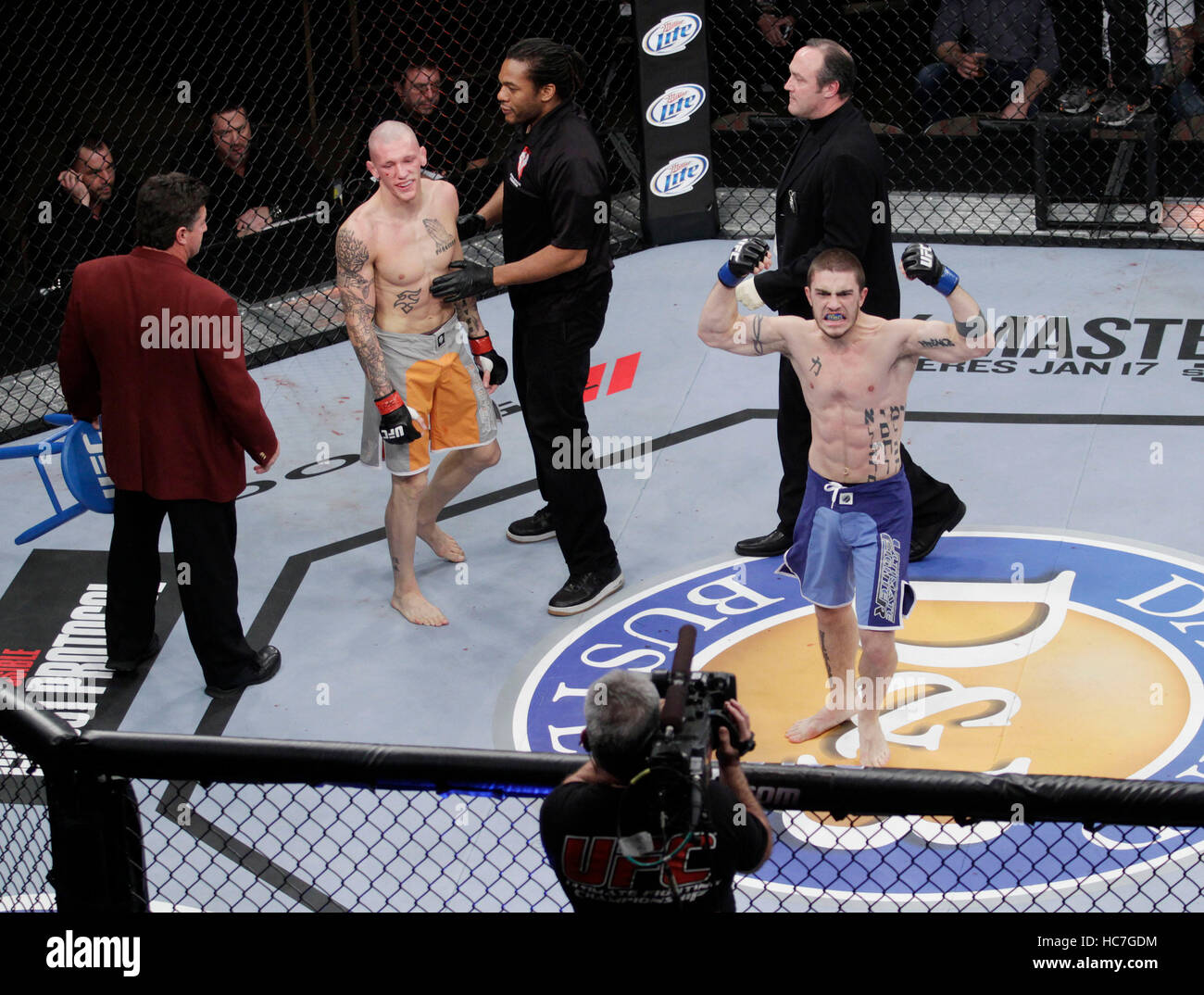 John Albert, right, celebrates his victory over Dustin Pague at The ...