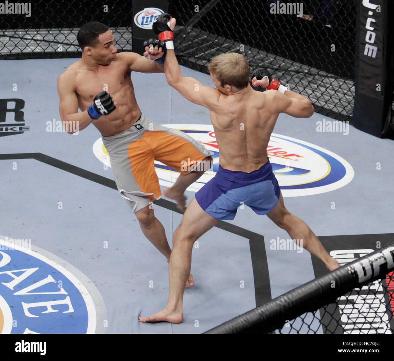 John Dodson, left, fights T.J. Dillashaw at The Ultimate Fighter 14 ...