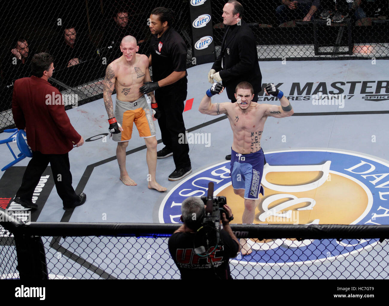 John Albert, right, celebrates his victory over Dustin Pague at The ...