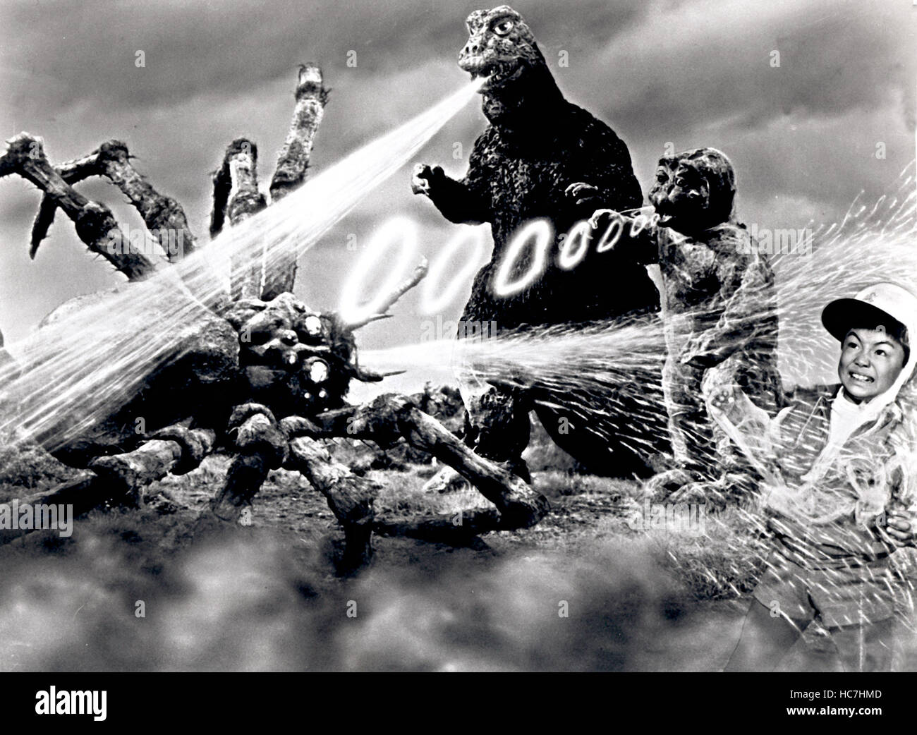 SON OF GODZILLA, a child running away from Godzilla, Minya, and Spiga ...