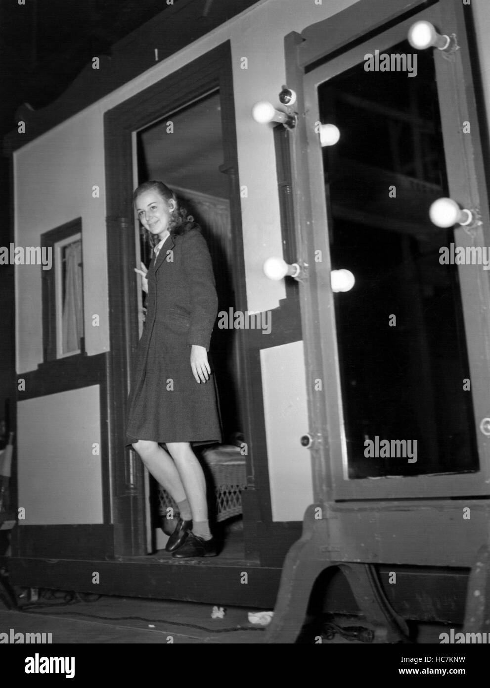 STELLA DALLAS, Anne Shirley standing by dressing room between scenes ...