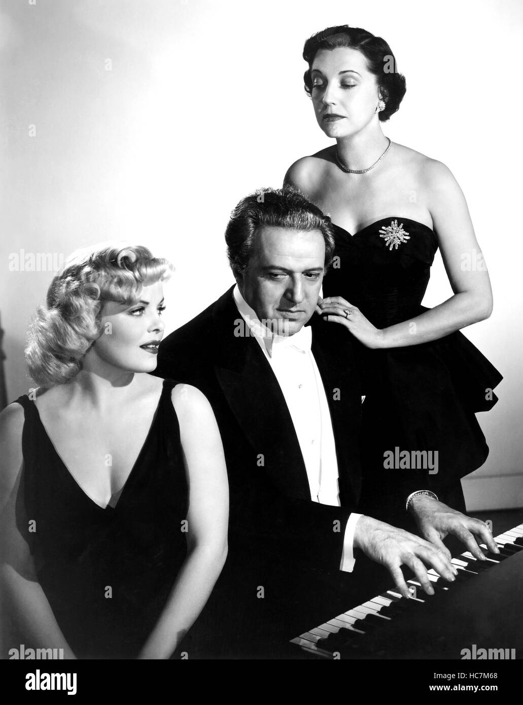 STRANGE FASCINATION, from left, Cleo Moore, Hugo Haas, Mona Barrie ...