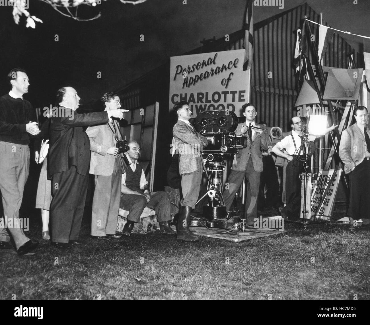 STAGE FRIGHT, director Alfred Hitchcock, (pointing, left), on-set, 1950 ...