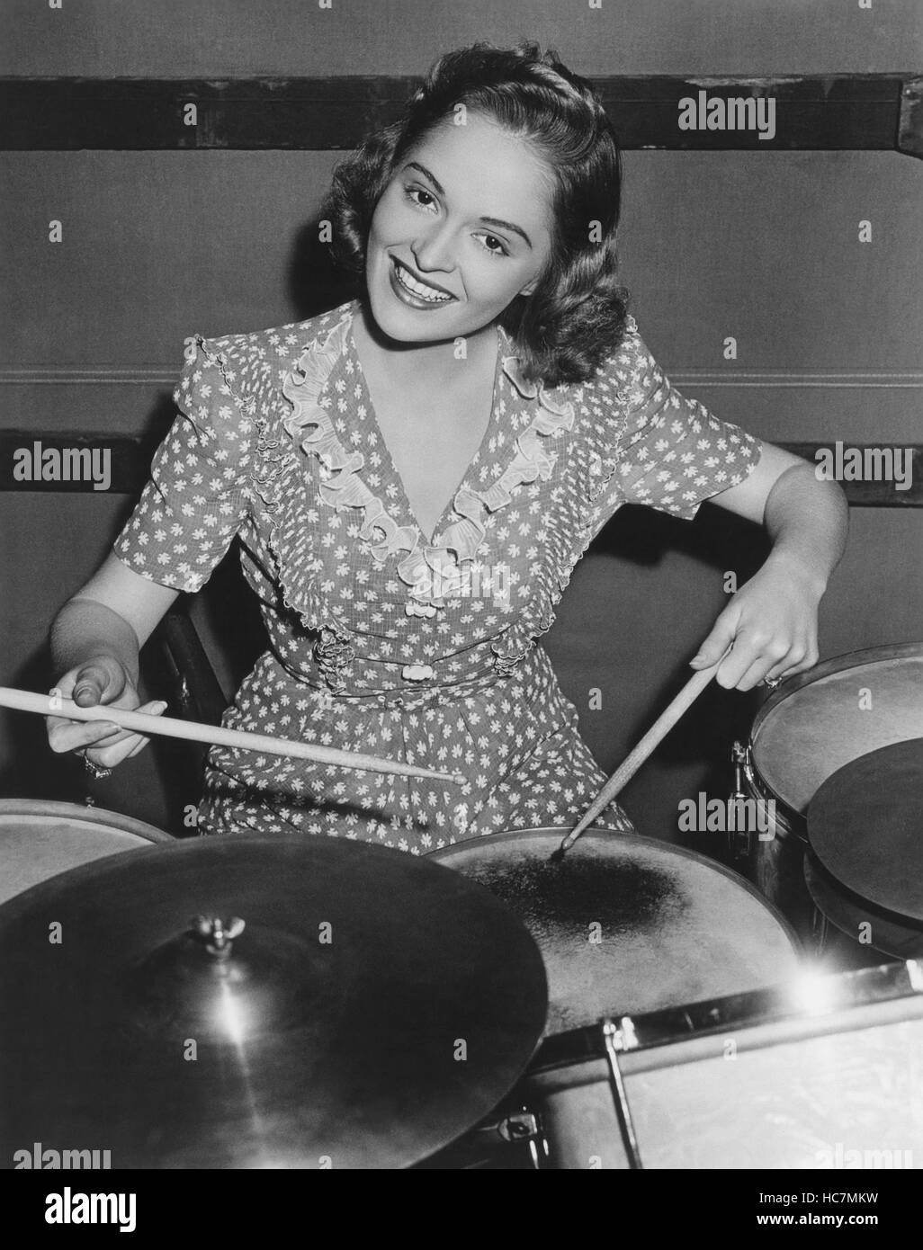 STRICTLY IN THE GROOVE, Mary Healy playing the drums on set, 1942 Stock ...
