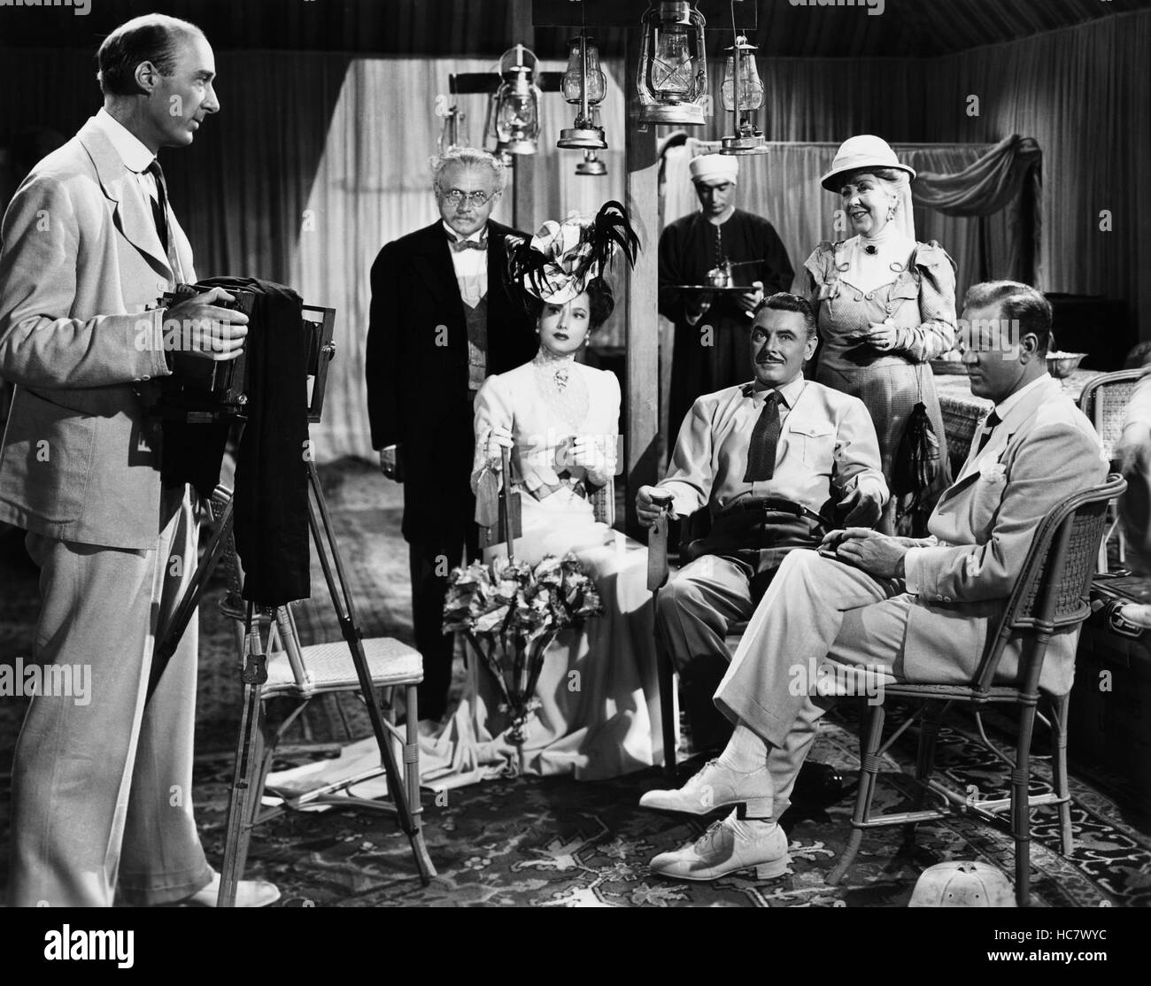 TEMPTATION, from left: Tom Stevenson, Ludwig Stossel, Merle Oberon ...