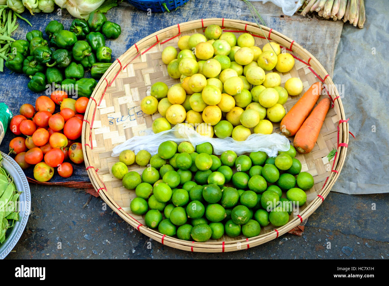 Basket of fruits and vegetables sold on the street in downtown Yangon ...