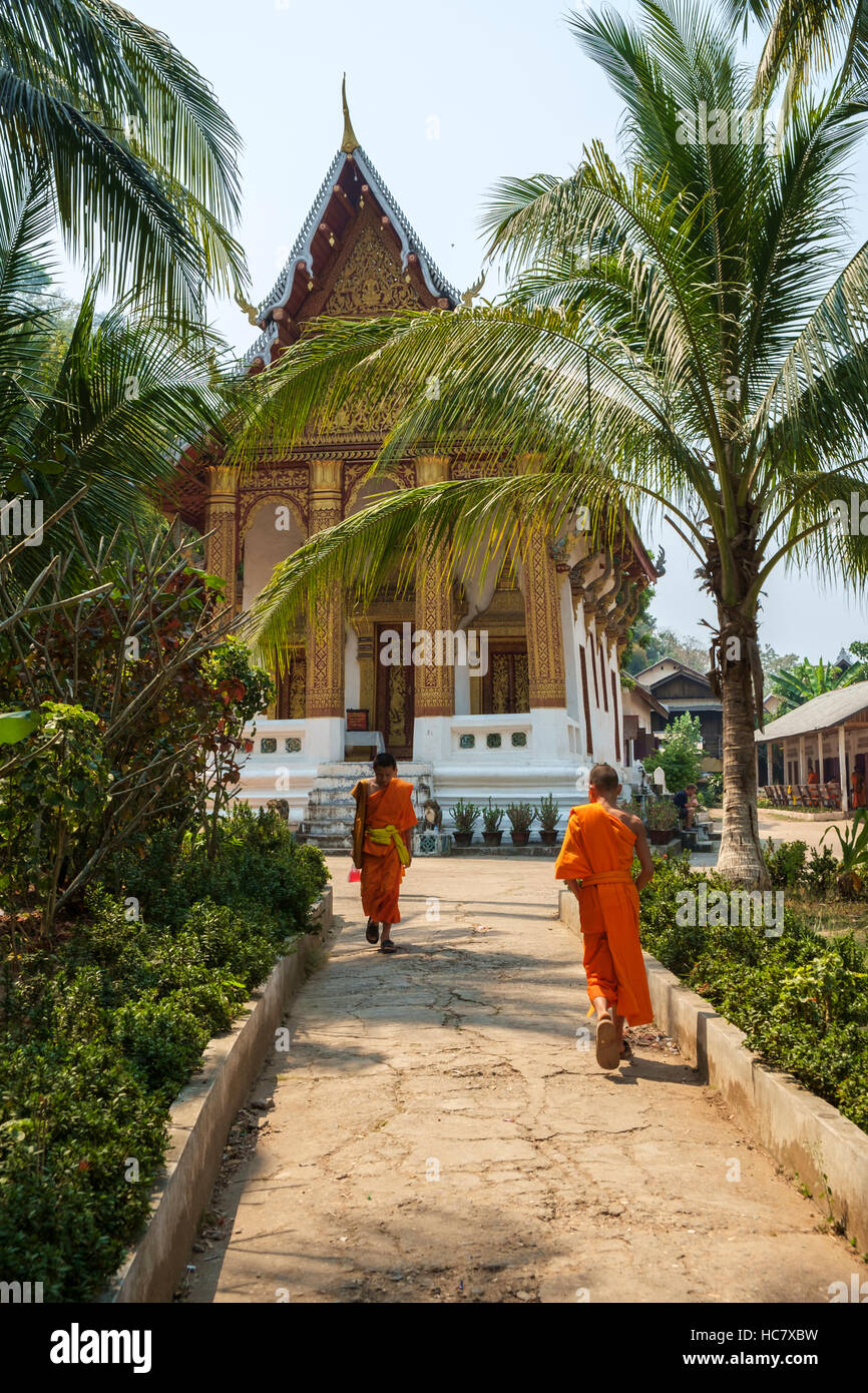 Two monks on the gorunds of Wat Siphoutthabath, Mount Phousi, Luang ...