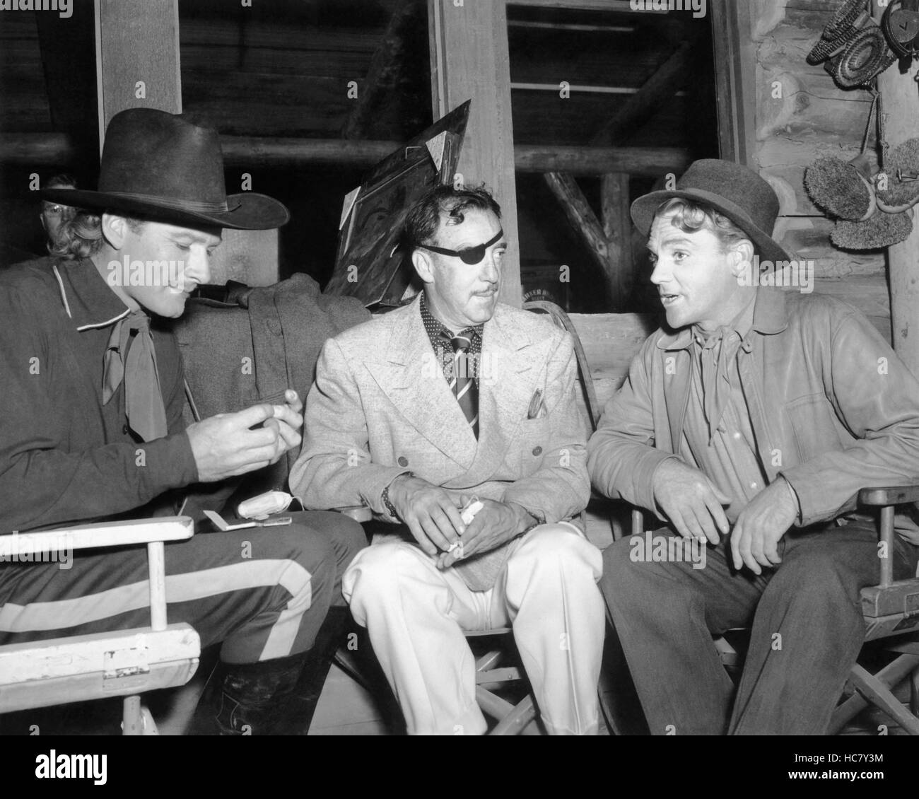 THEY DIED WITH THEIR BOOTS ON, from left, Errol Flynn, director Raoul ...