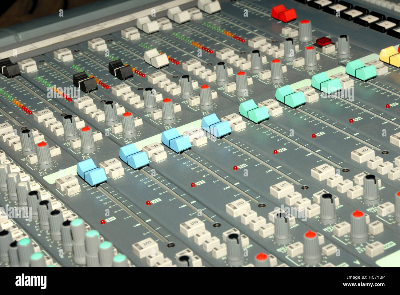 Audio mixing console in a recording studio. Faders and knobs of a sound ...