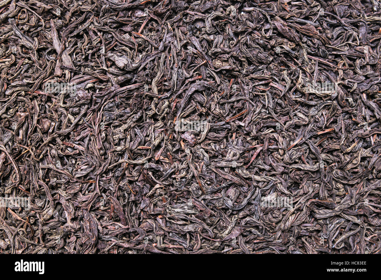 Dried black tea leaves background, texture Stock Photo - Alamy