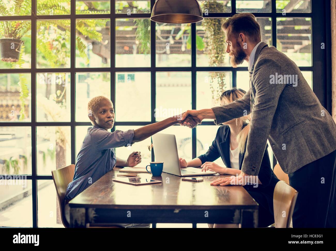 Multiethnic Business Partners Handshake Deal Team Concept Stock Photo ...