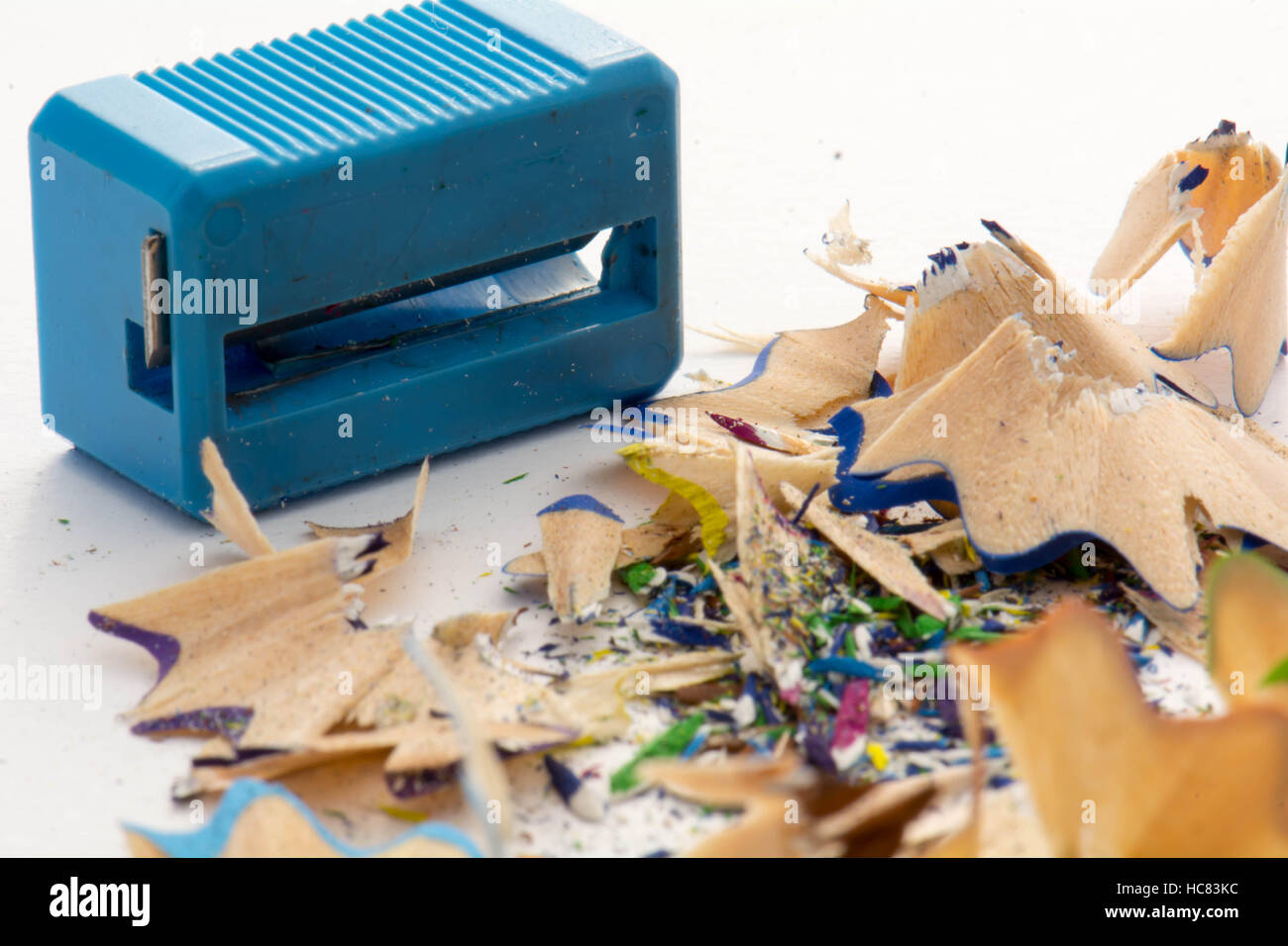 green color pencil and blue sharpener, on white background Stock Photo ...