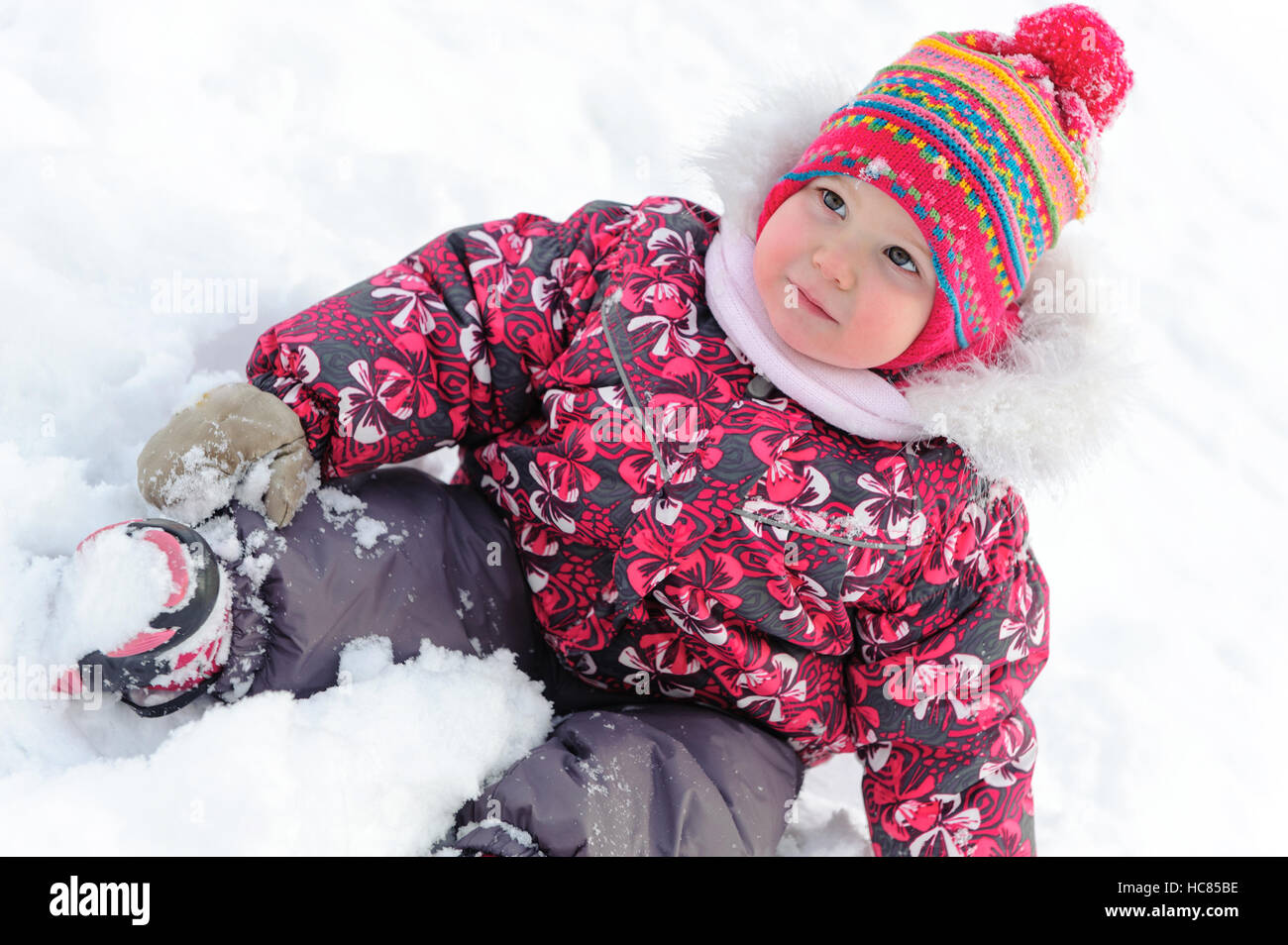 Cute lovely girl has a fun in snow Stock Photo - Alamy