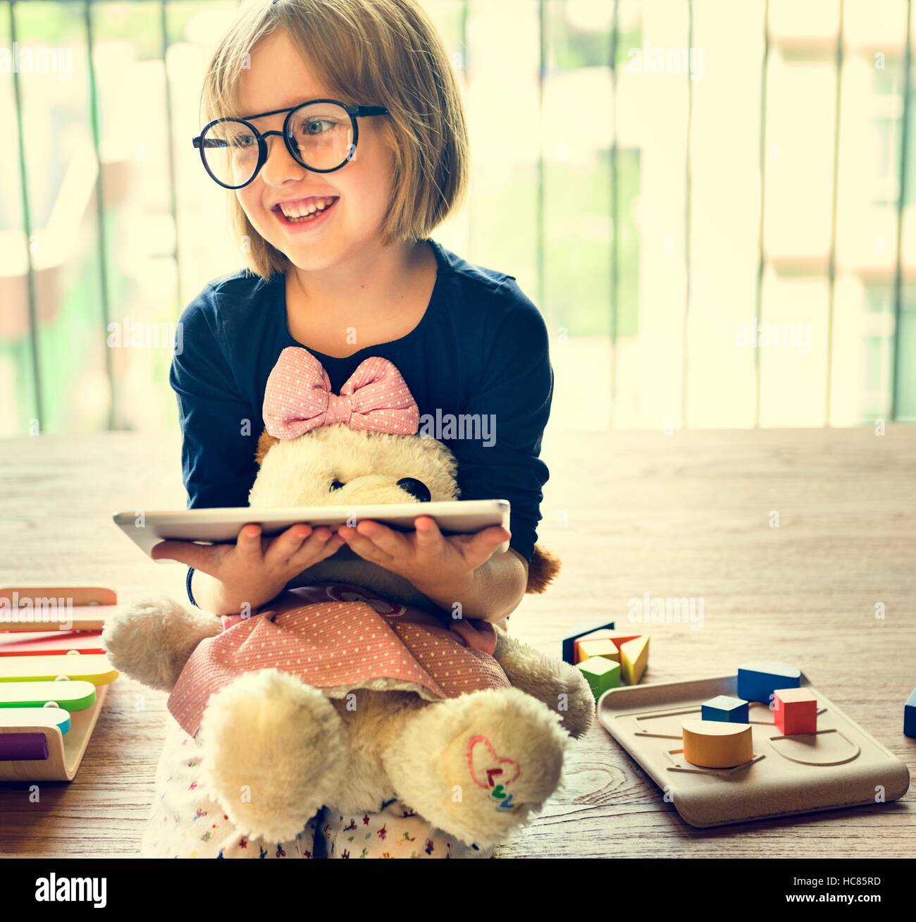 Little Girl Using Device Concept Stock Photo - Alamy