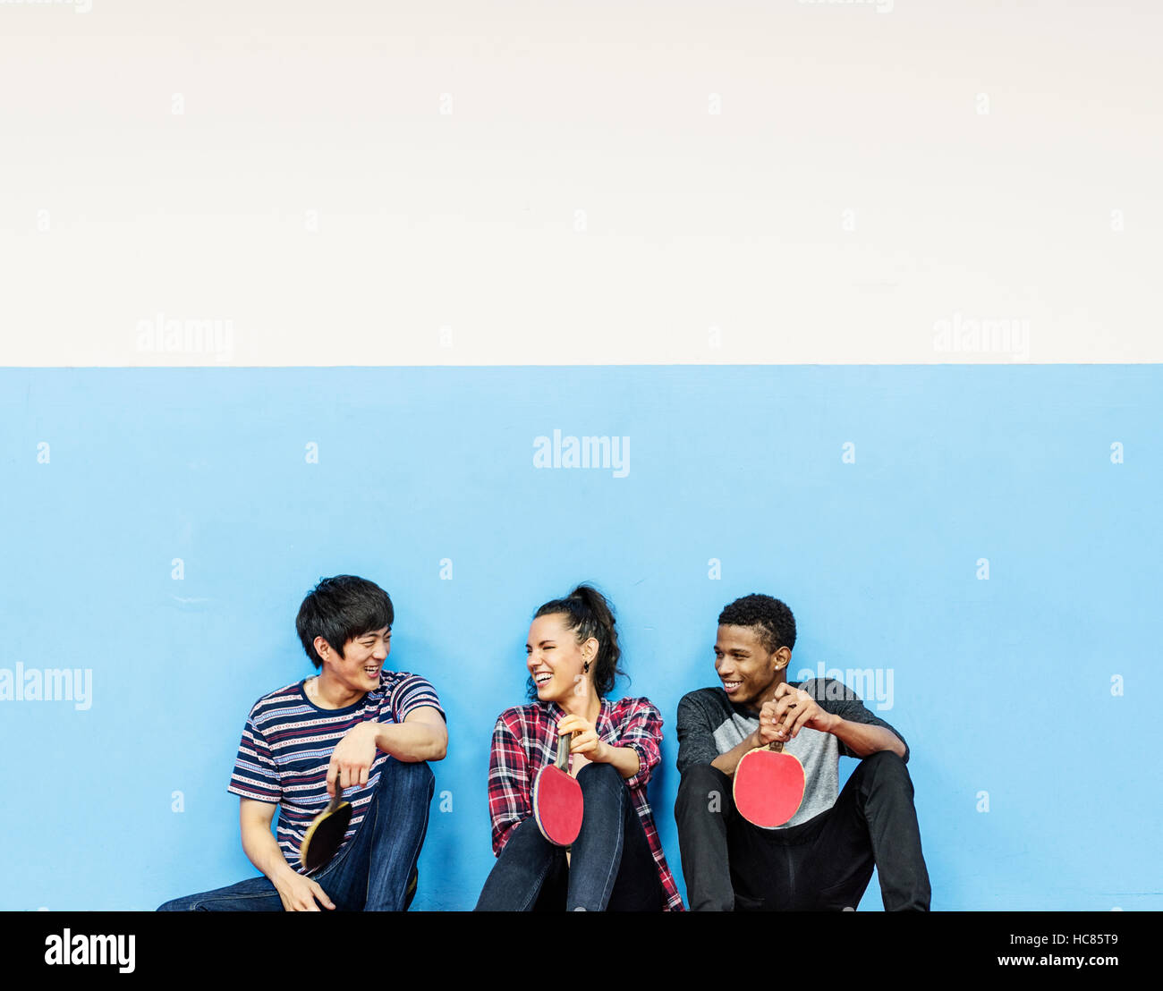 Diverse friends playing tennis hi-res stock photography and images - Alamy