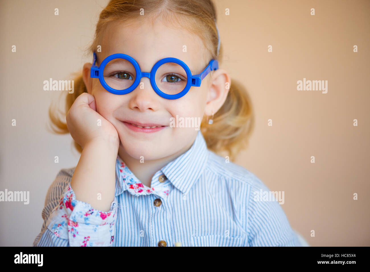 Portrait of cute little girl in glasses Stock Photo - Alamy