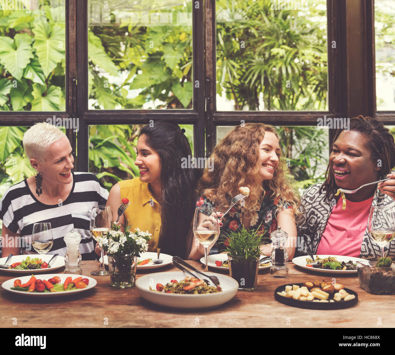 Diversity Women Group Hanging Eating Together Concept Stock Photo - Alamy