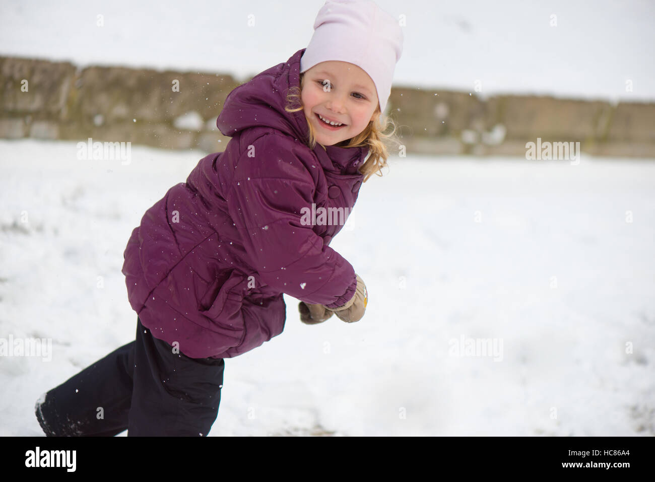 Children throwing snowballs in snowy winter park Stock Photo - Alamy