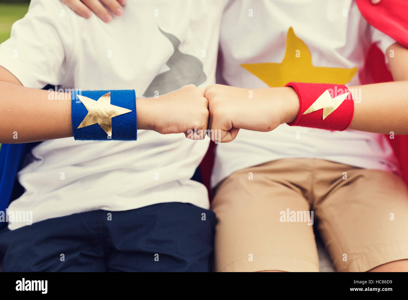Superheroes Kids Fist Bump Powerful Concept Stock Photo - Alamy