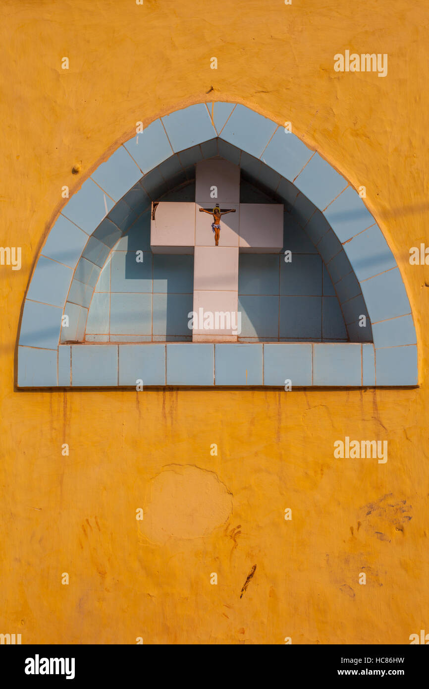 Small crucifix built into an arch in a house wall, Panjim, Goa, India ...
