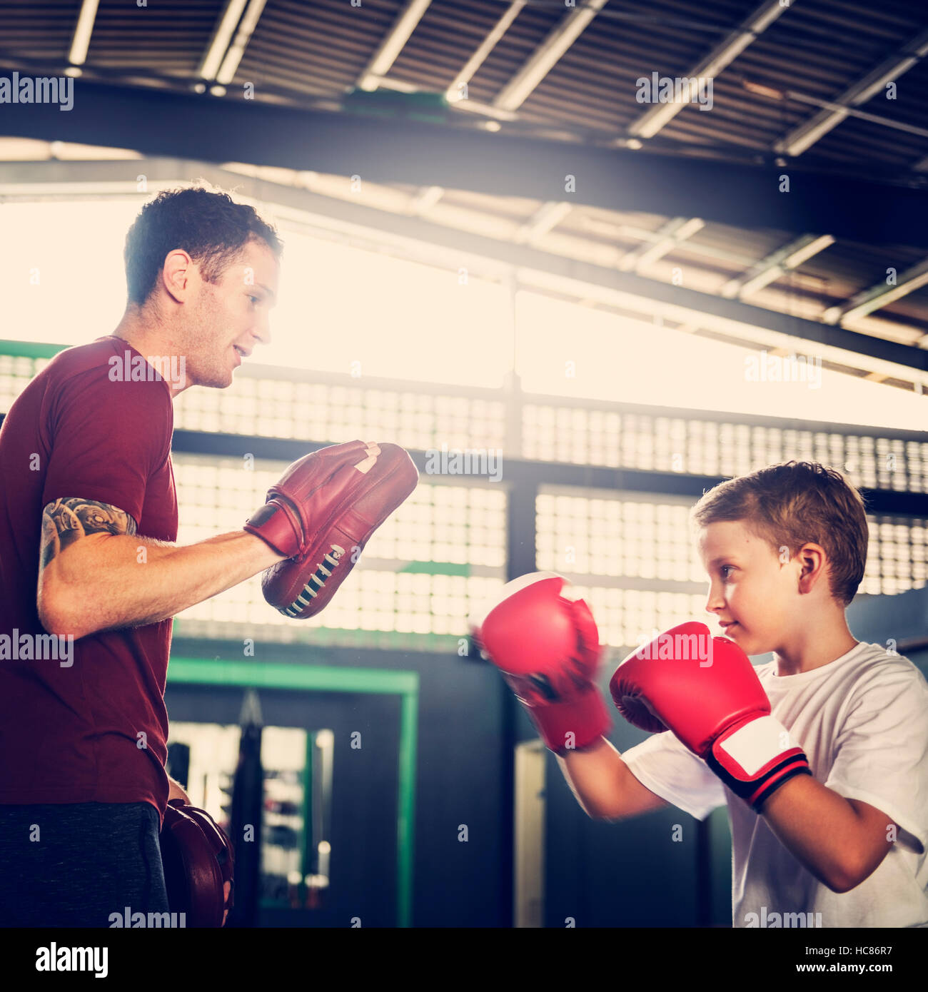 Boy Boxing Training Punch Mitts Exercise Concept Stock Photo - Alamy