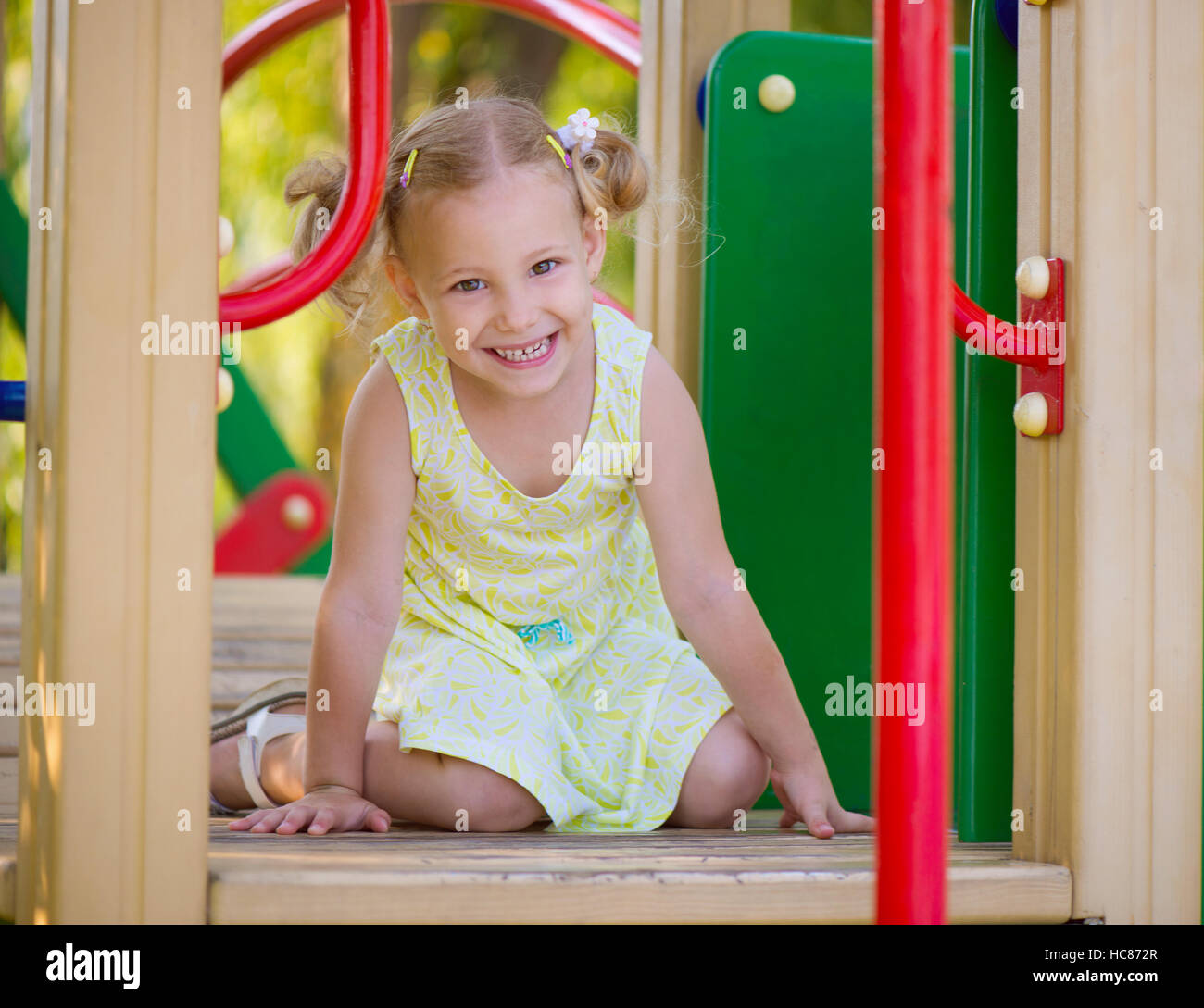 Happy little girl play joyful at playground Stock Photo - Alamy
