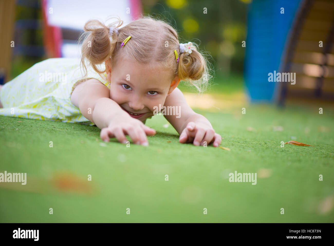 Happy little girl play joyful at playground Stock Photo - Alamy