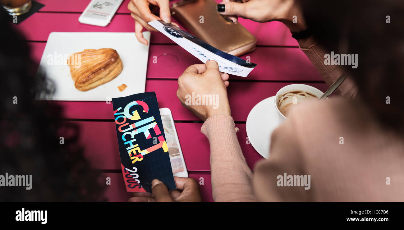 Women Share Gift Voucher Concept Stock Photo - Alamy
