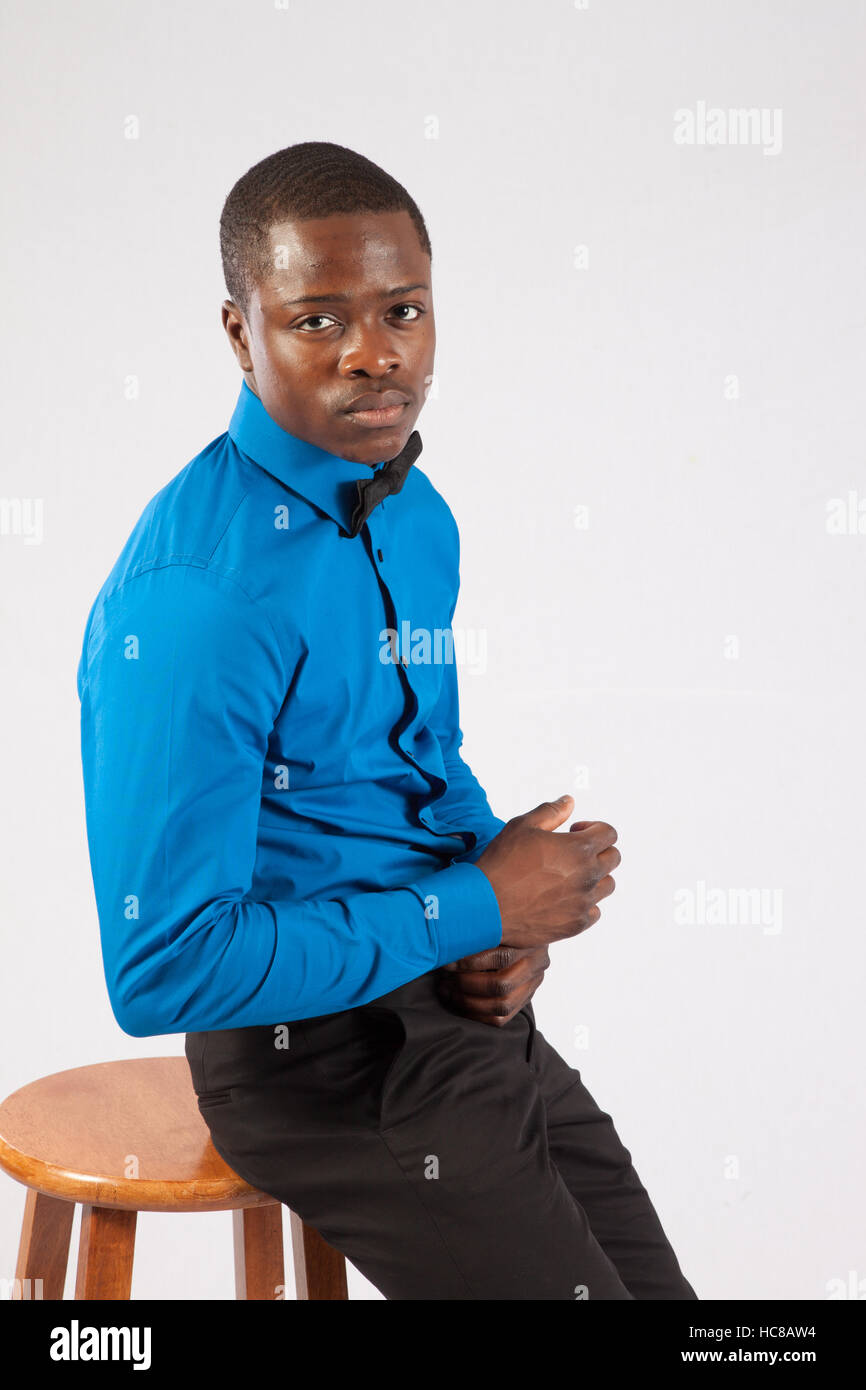 Handsome Black man in bow tie, looking thoughtfully at the camera Stock ...