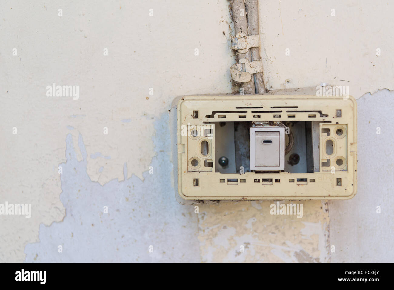 Close-up of old socket, electrical outlet, damaged wall socket or ...